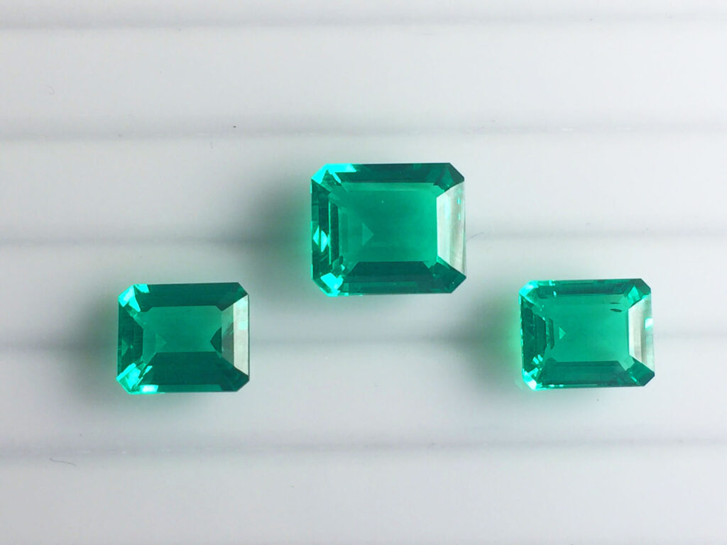 Created Emerald rough, created emerald faceted and cabochon